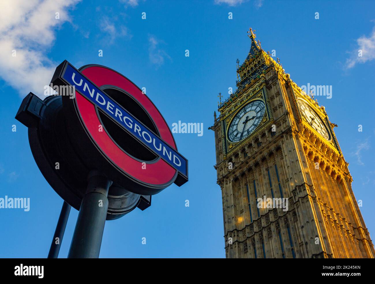 A picture of the Big Ben next to the Tube sign at Westminster Stock ...