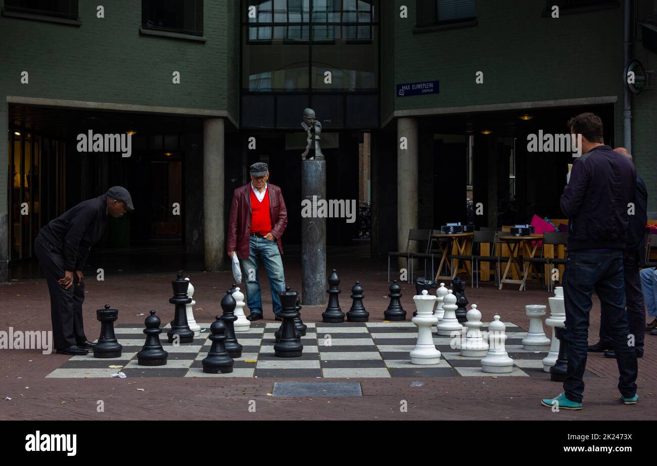 A picture of people playing giant chess in the street (Amsterdam Stock ...