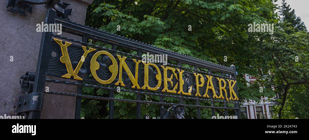 A picture of a metal gate that marks the entrance to Vondelpark ...