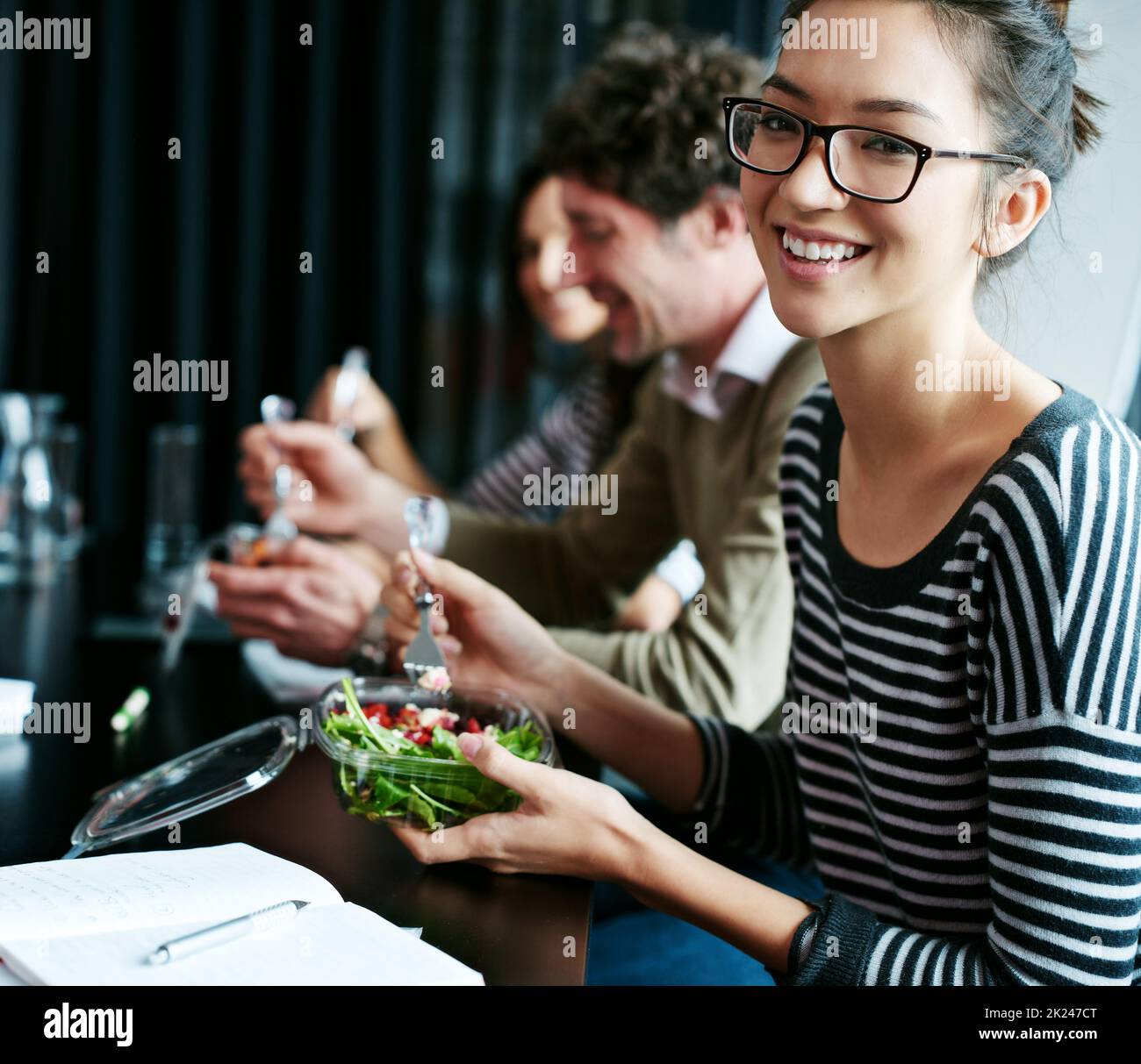 Fuelling up for the work day. Portrait of a young office worker eating ...