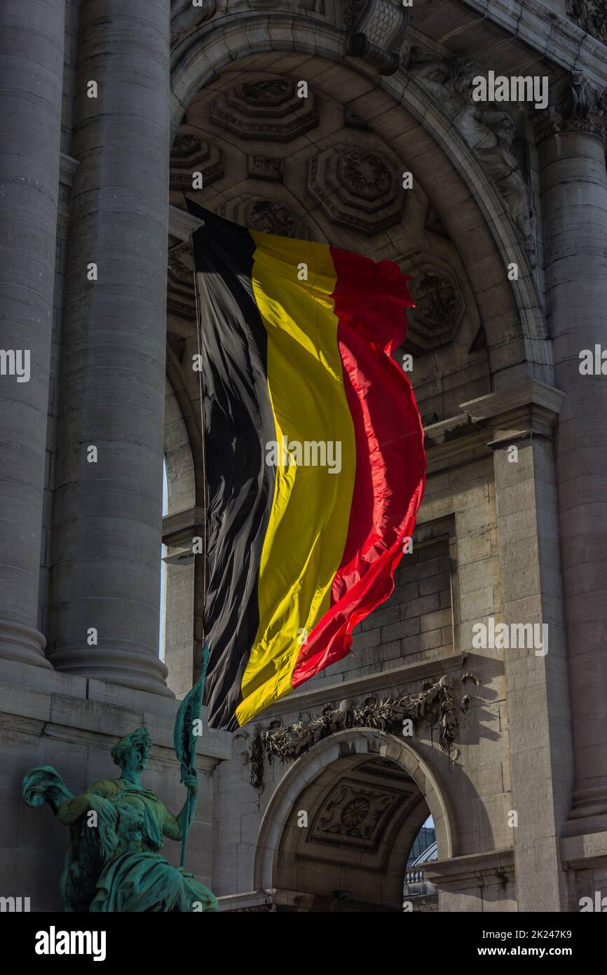 A picture of a giant Belgian flag waving in the Parc du Cinquantenaire ...