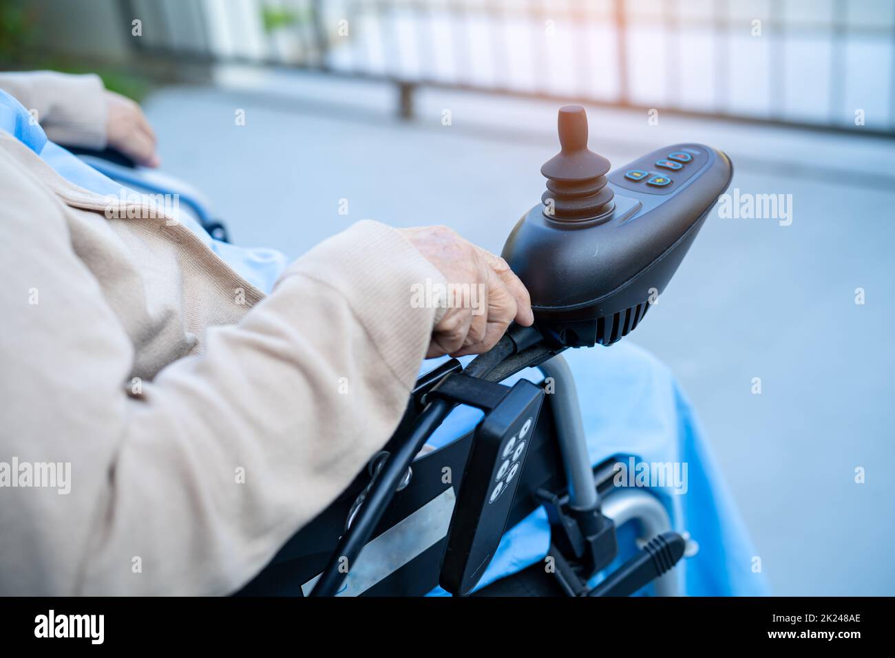 Asian senior or elderly old lady woman patient on electric wheelchair ...