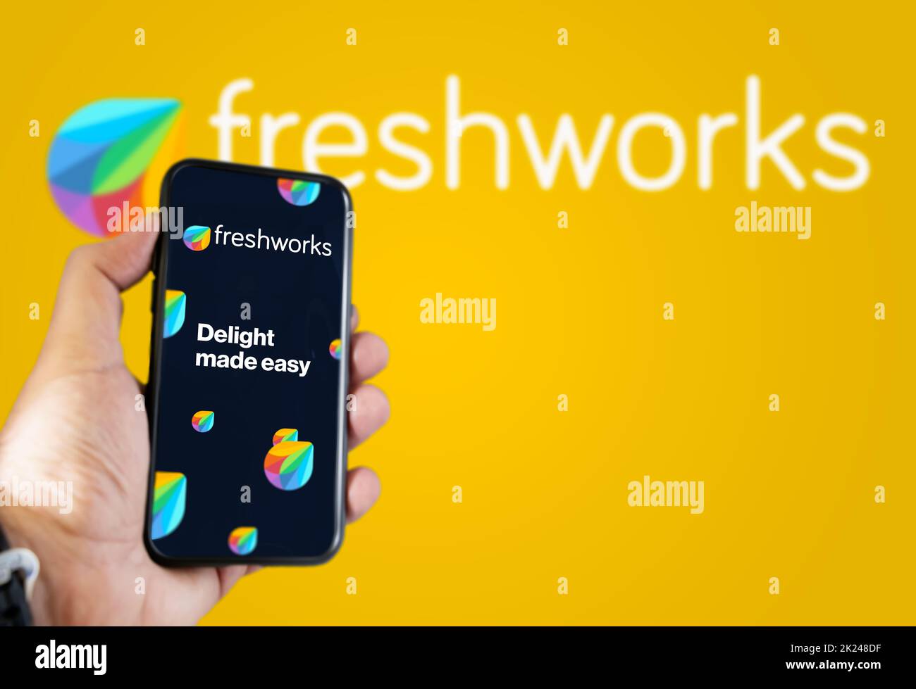 San Francisco, USA, December 2021: Hand holding a phone with Freshworks ...
