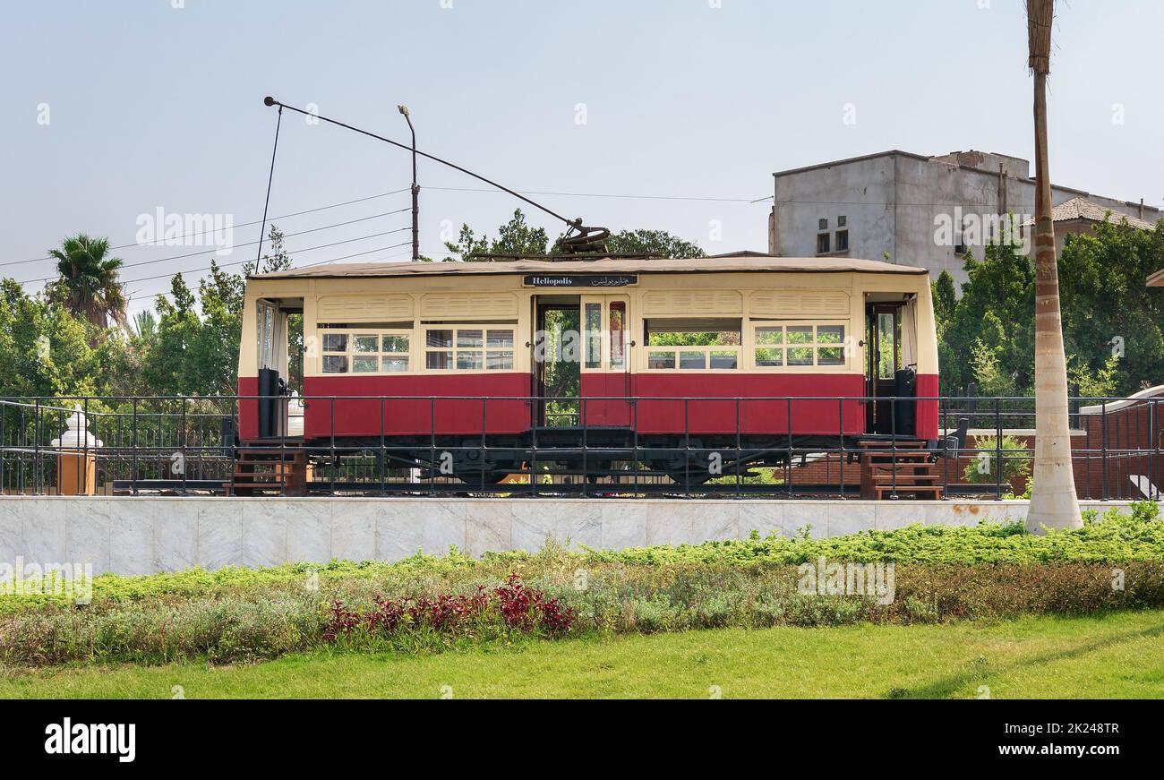 Exterior of vintage tram with wooden stairs near open doors located on ...