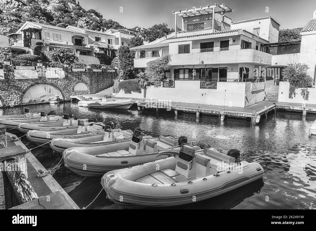 View of the harbor with luxury yachts of Poltu Quatu, Sardinia, Italy ...