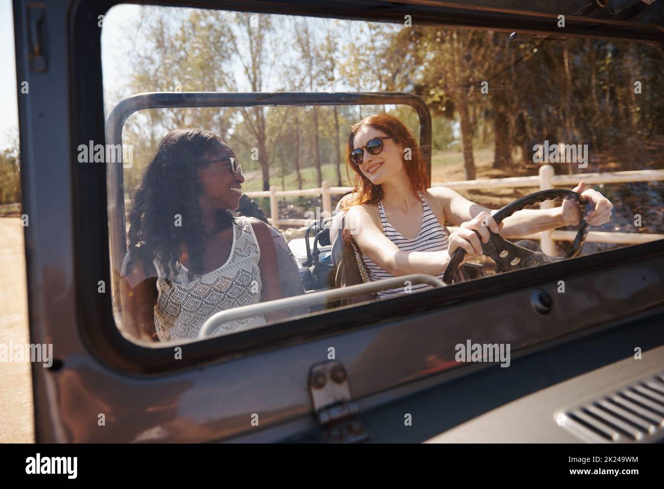 Roadtripping with my bestie. two attractive women taking a roadtrip together Stock Photo - Alamy