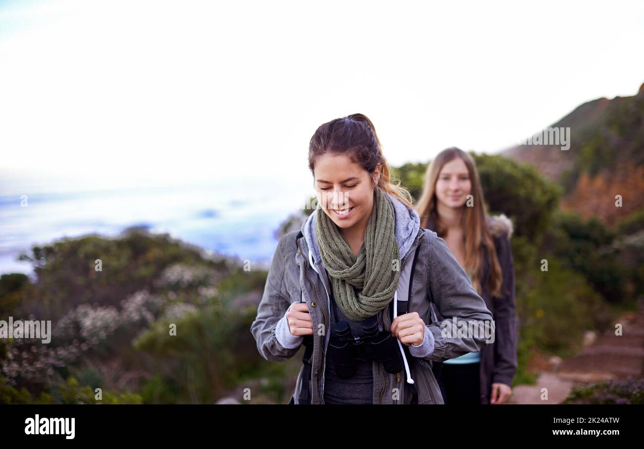 Girls hike. two attractive young female hikers in the outdoors Stock ...
