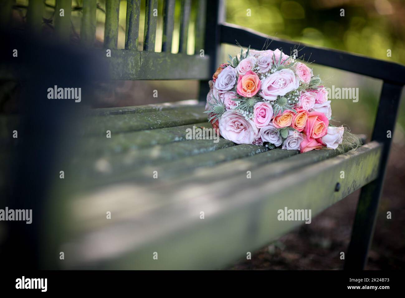 The Brides bouquet on a bench Stock Photo - Alamy