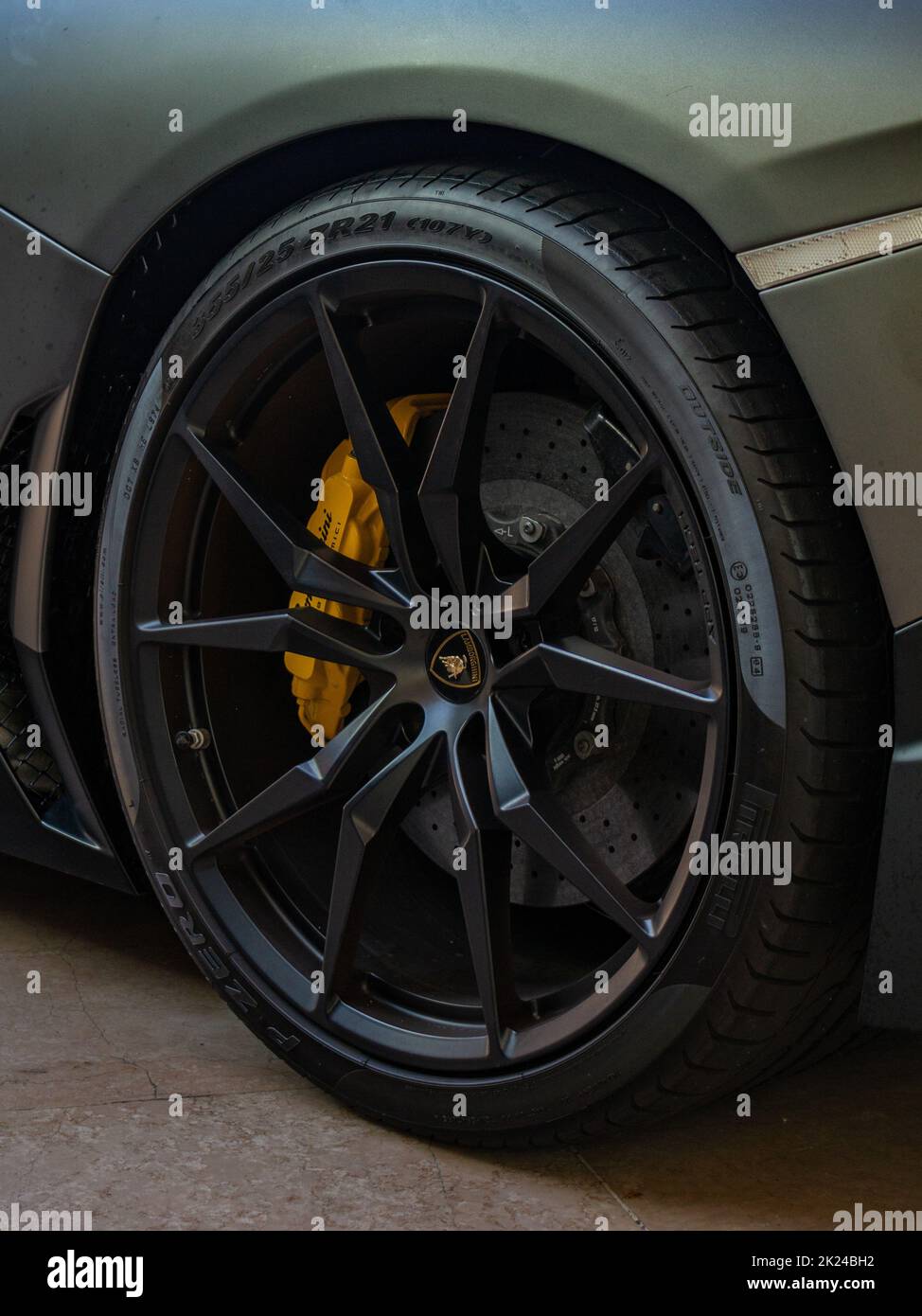 A close-up picture of a sports tire and wheel used by a Lamborghini ...
