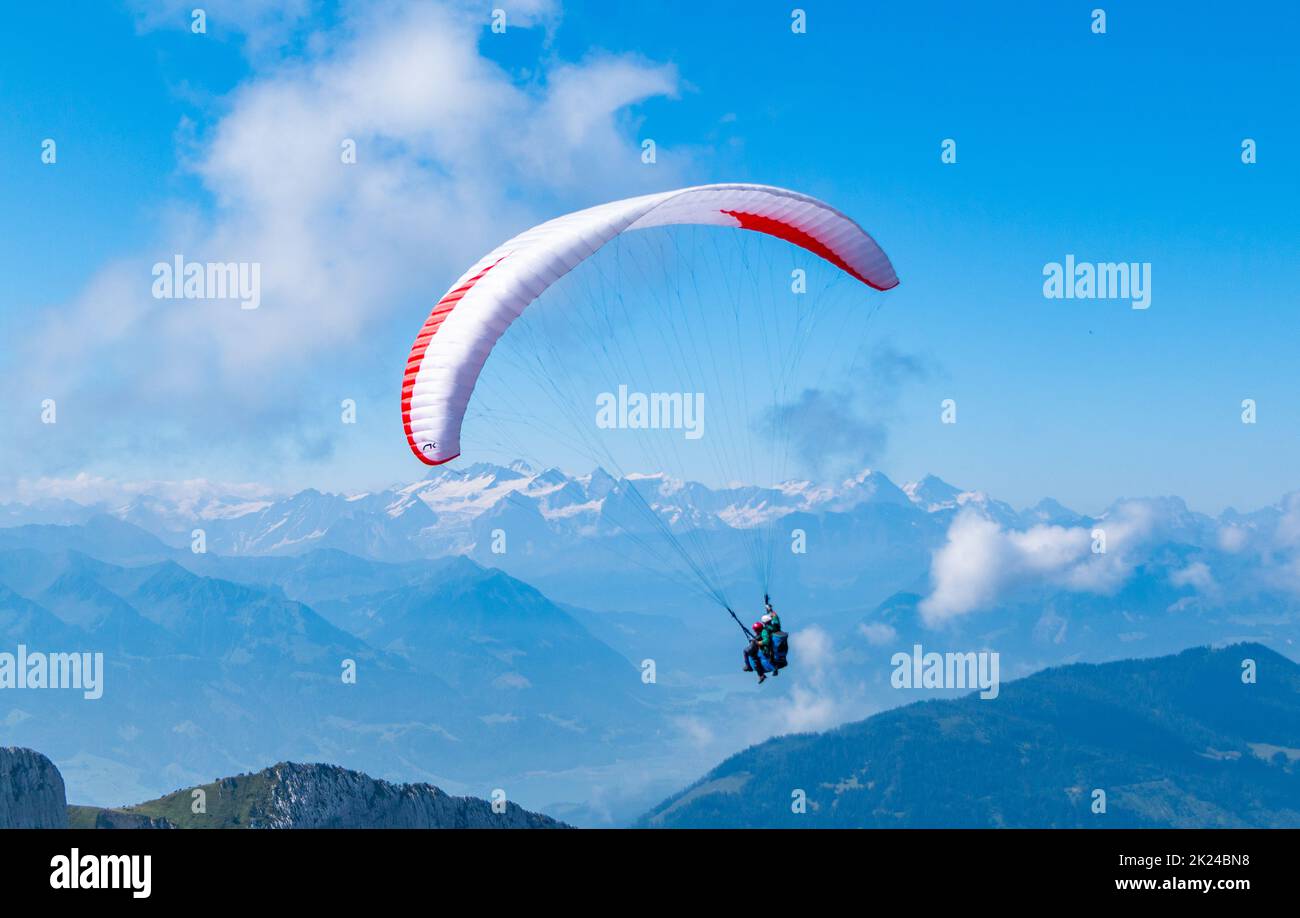 A picture of people paragliding at the top of Mount Pilatus Stock Photo ...