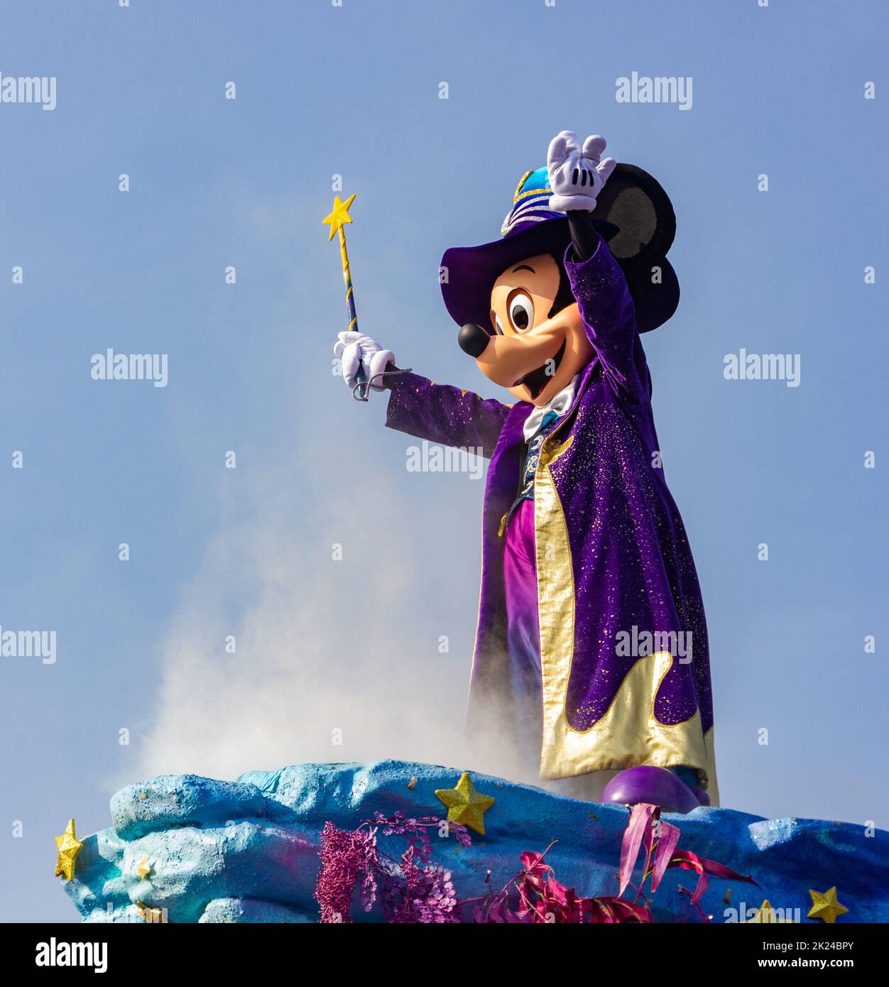 A picture of a happy Mickey Mouse riding on top of a parade Stock Photo ...