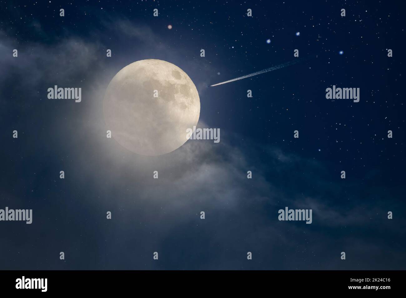 Cloudy full moon night with stars Stock Photo - Alamy