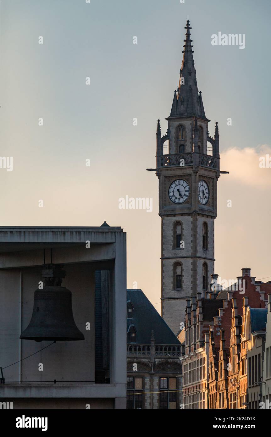 A picture of the Ghent Clock Tower in Korenmarkt rising above the ...