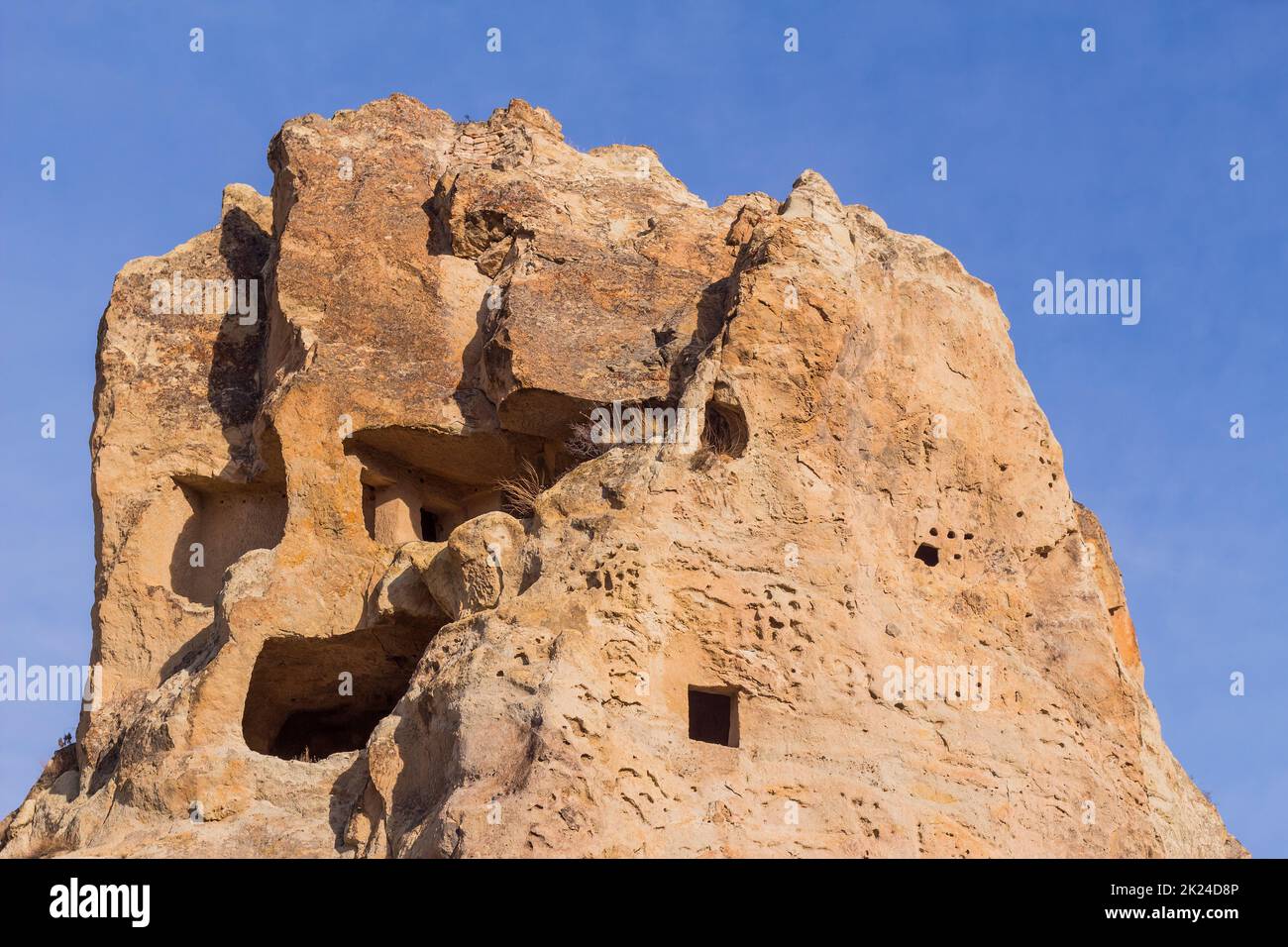View of house carved in cave. Ruins of an ancient cave house ...