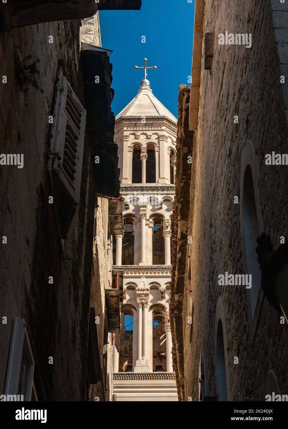 A picture of Saint Domnius Cathedral's tower between two building ...