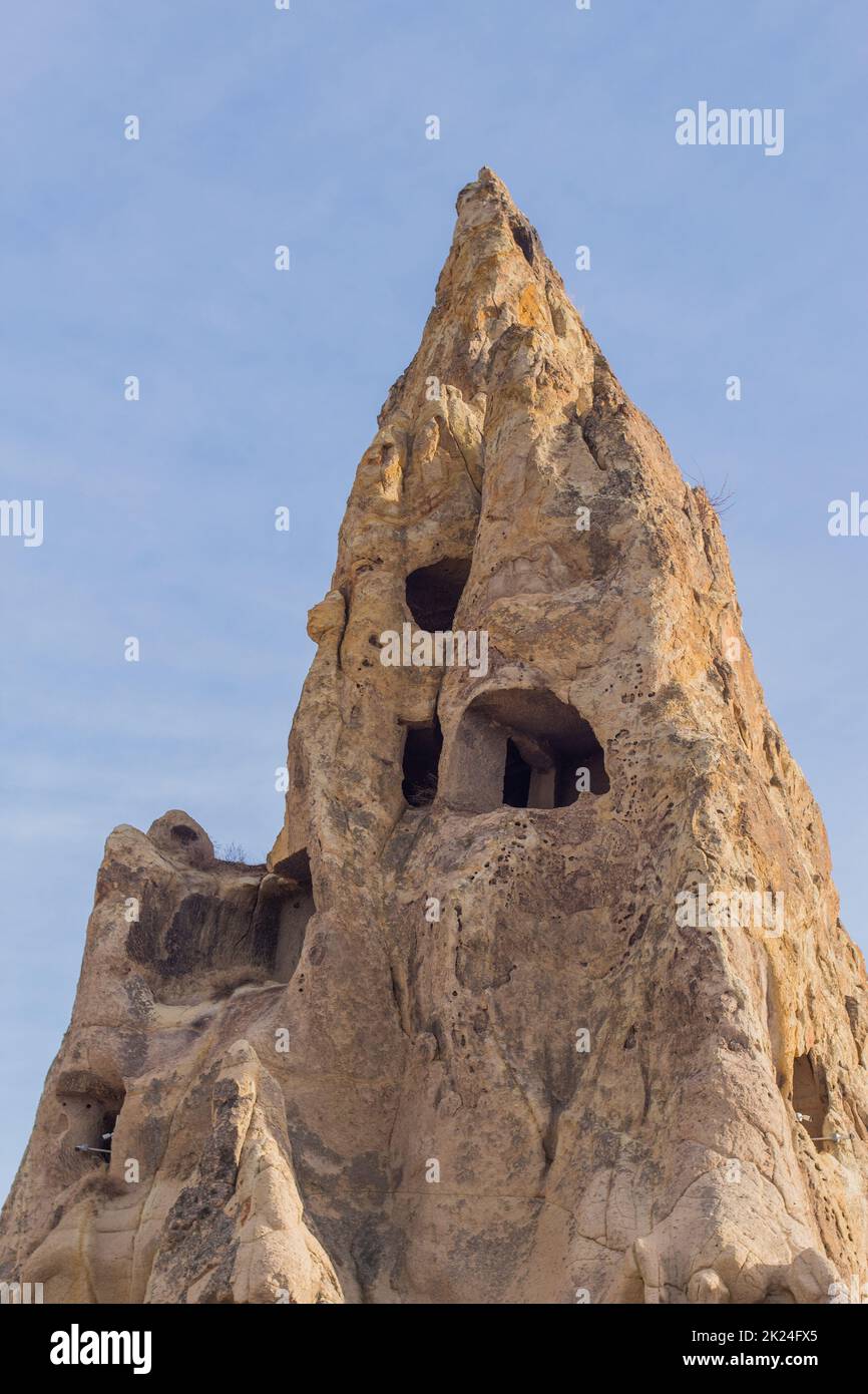 Cave houses and buildings in Cappadocia, Turkey. Stone peaks with doors ...