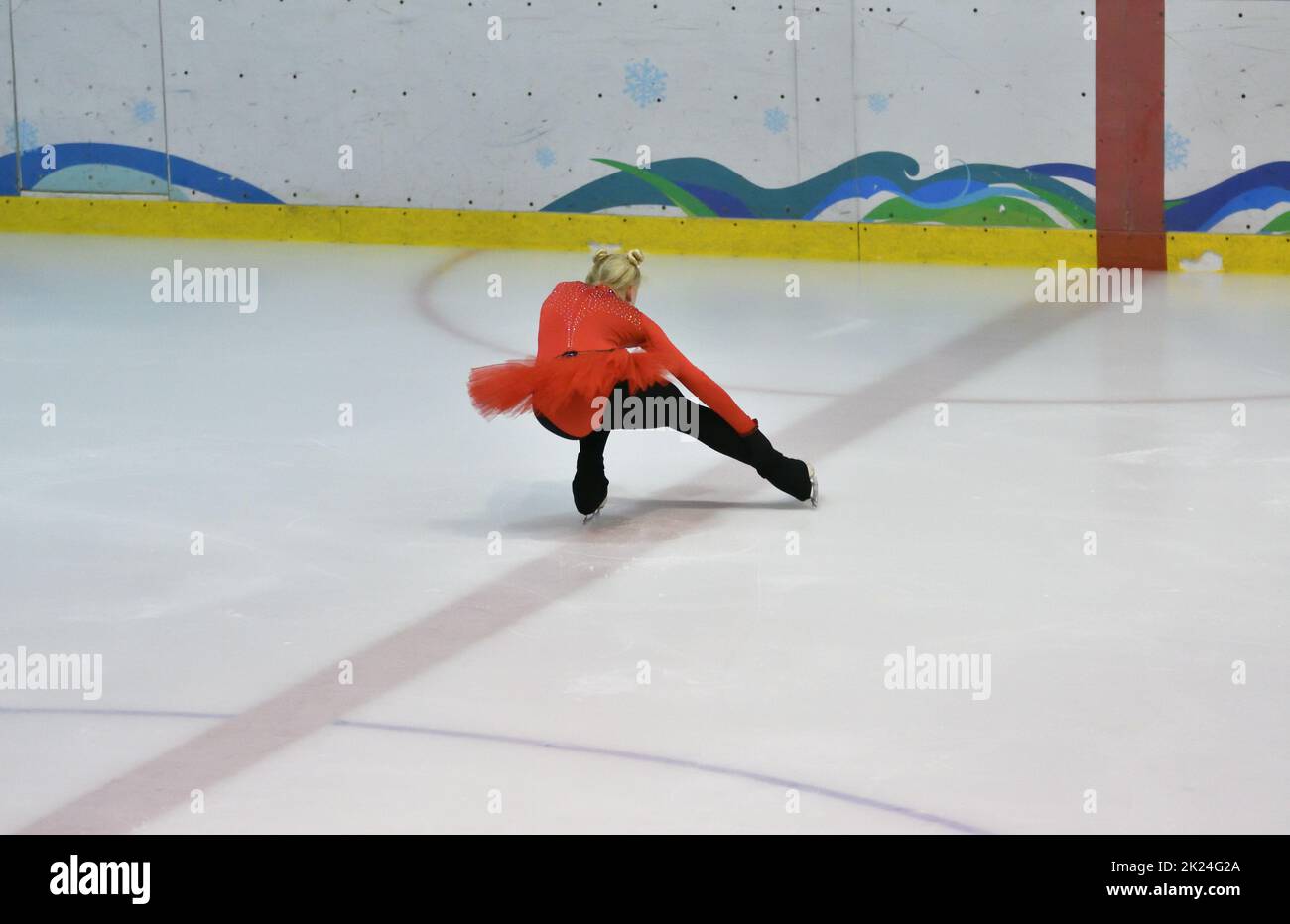 Girl figure skater rolls on a skating rink with artificial ice Stock ...