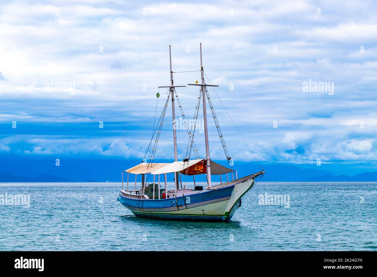 Ship sailing speed boats and yachts at Praia de Palmas beach Ilha ...