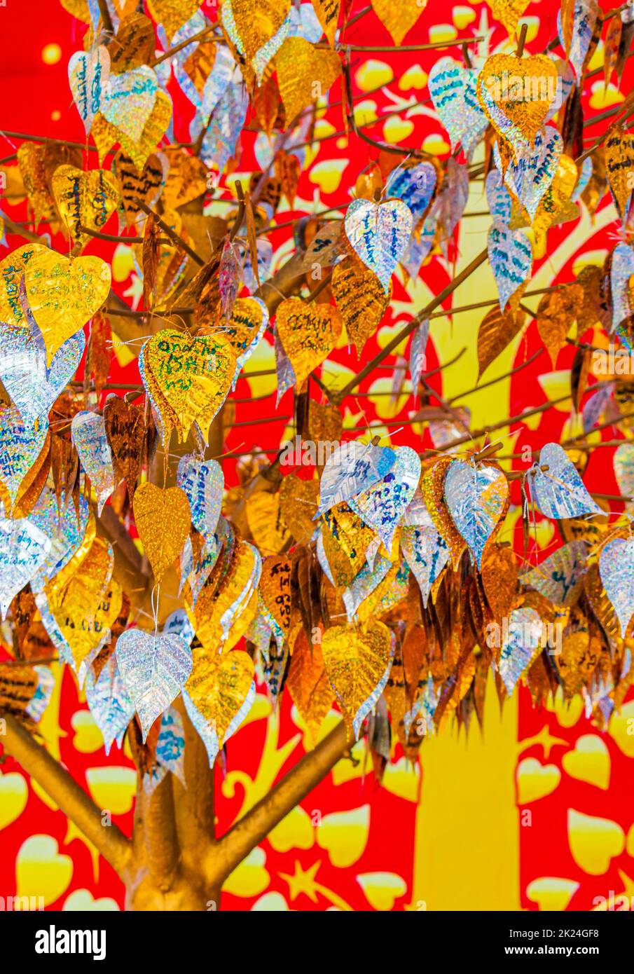 Make merit golden and red money tree at colorful Wat Don Mueang Phra ...