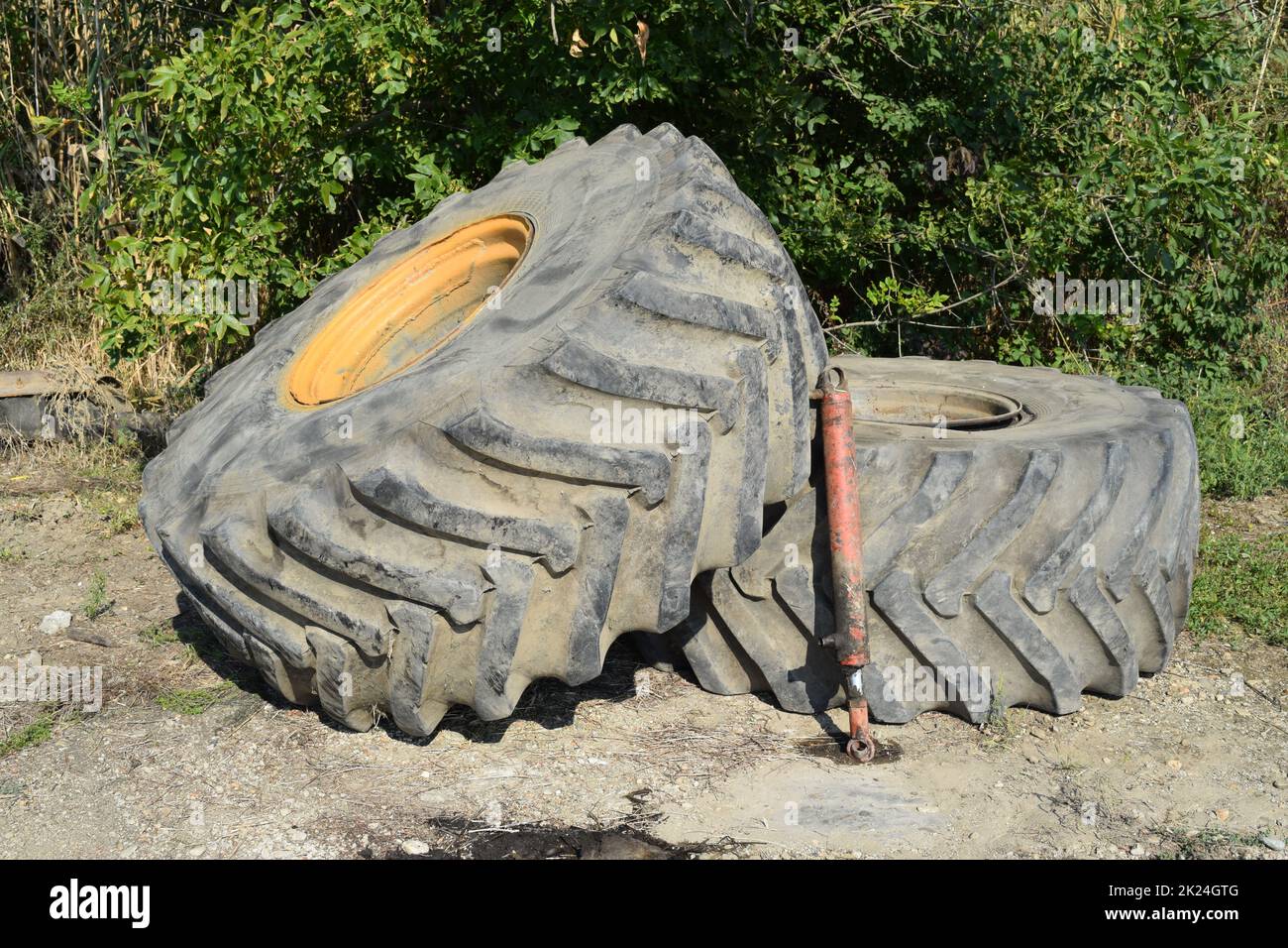 Broken flat tire on a large tractor. Damaged wheels Stock Photo - Alamy