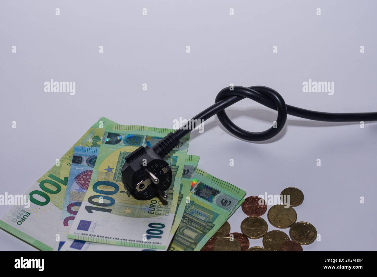 Energy prices increase and energy consumption power cable with knot and ...