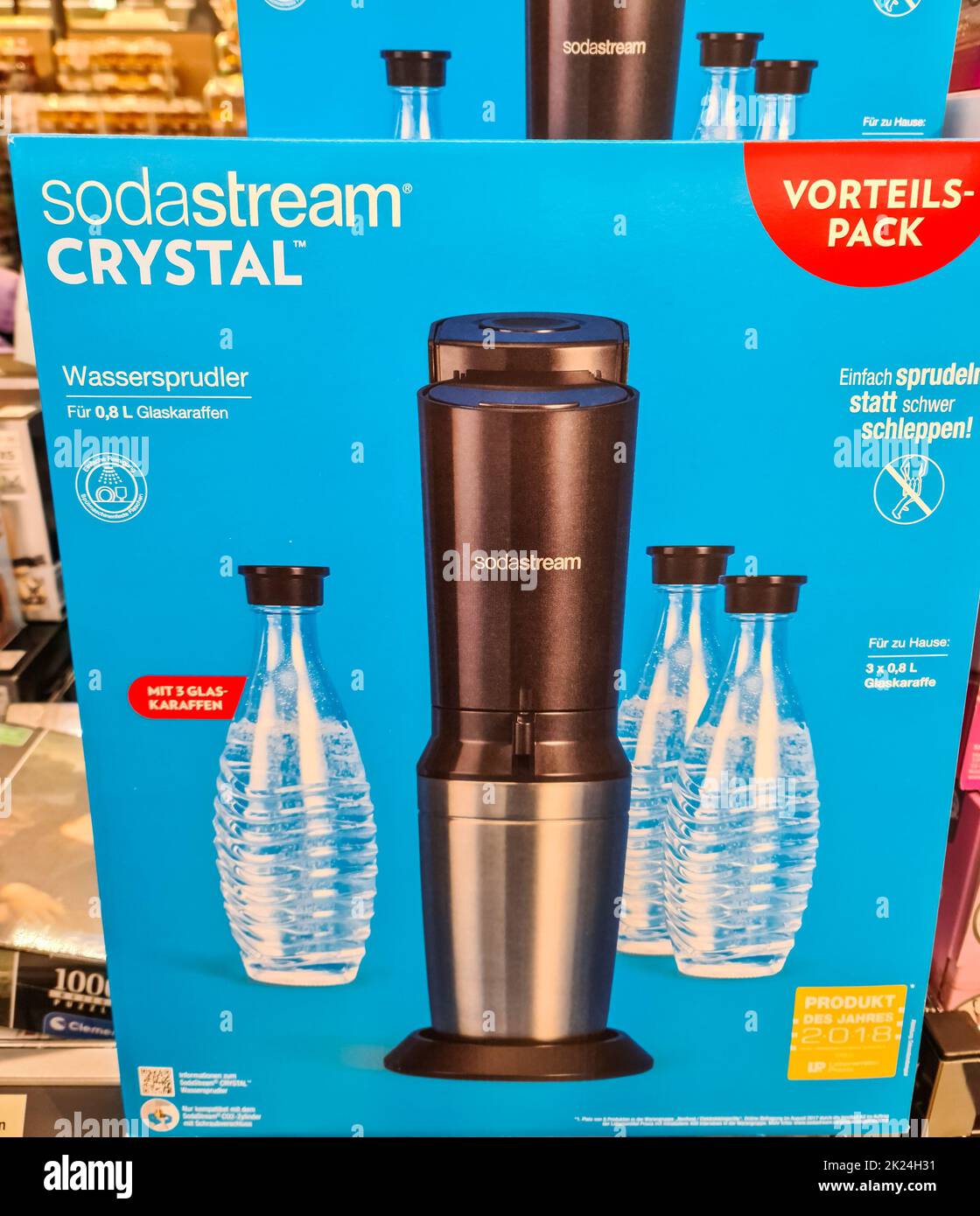A blue carton of a Soda Stream Crystal brand seltzer water dispenser ...
