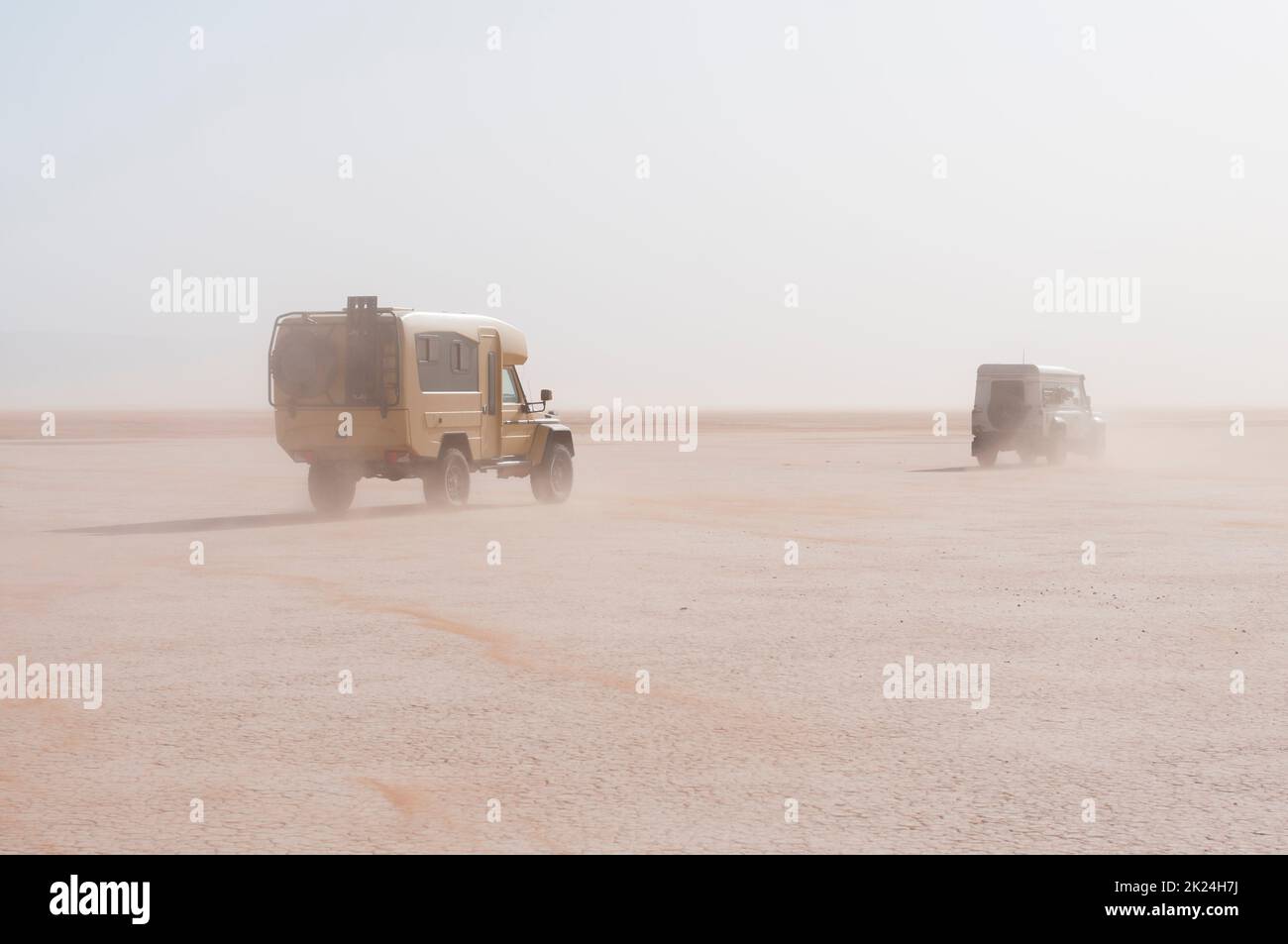 Off-road vehicle drive in the sandstorm in the Sahara, on the Lac Iriki ...