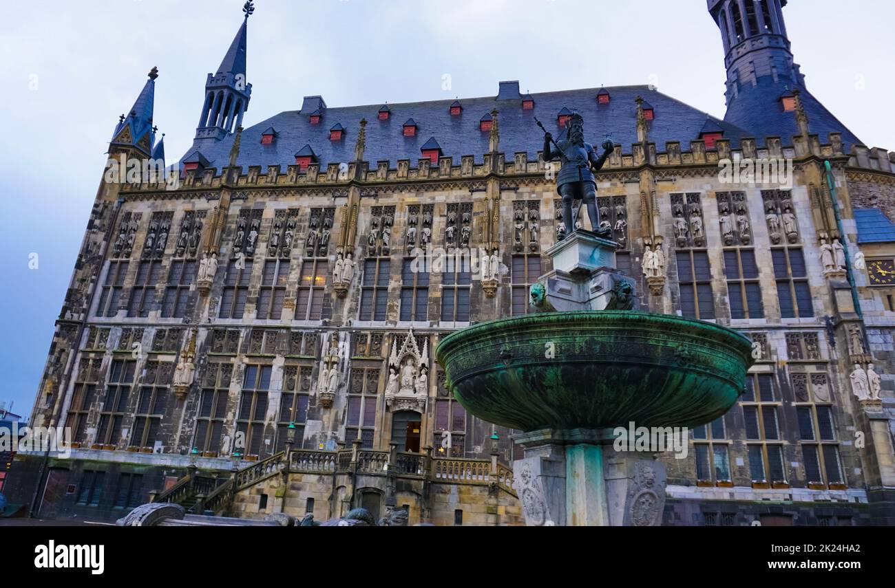 Ancient stone walls and details of Aachen Town Hall on a background of ...