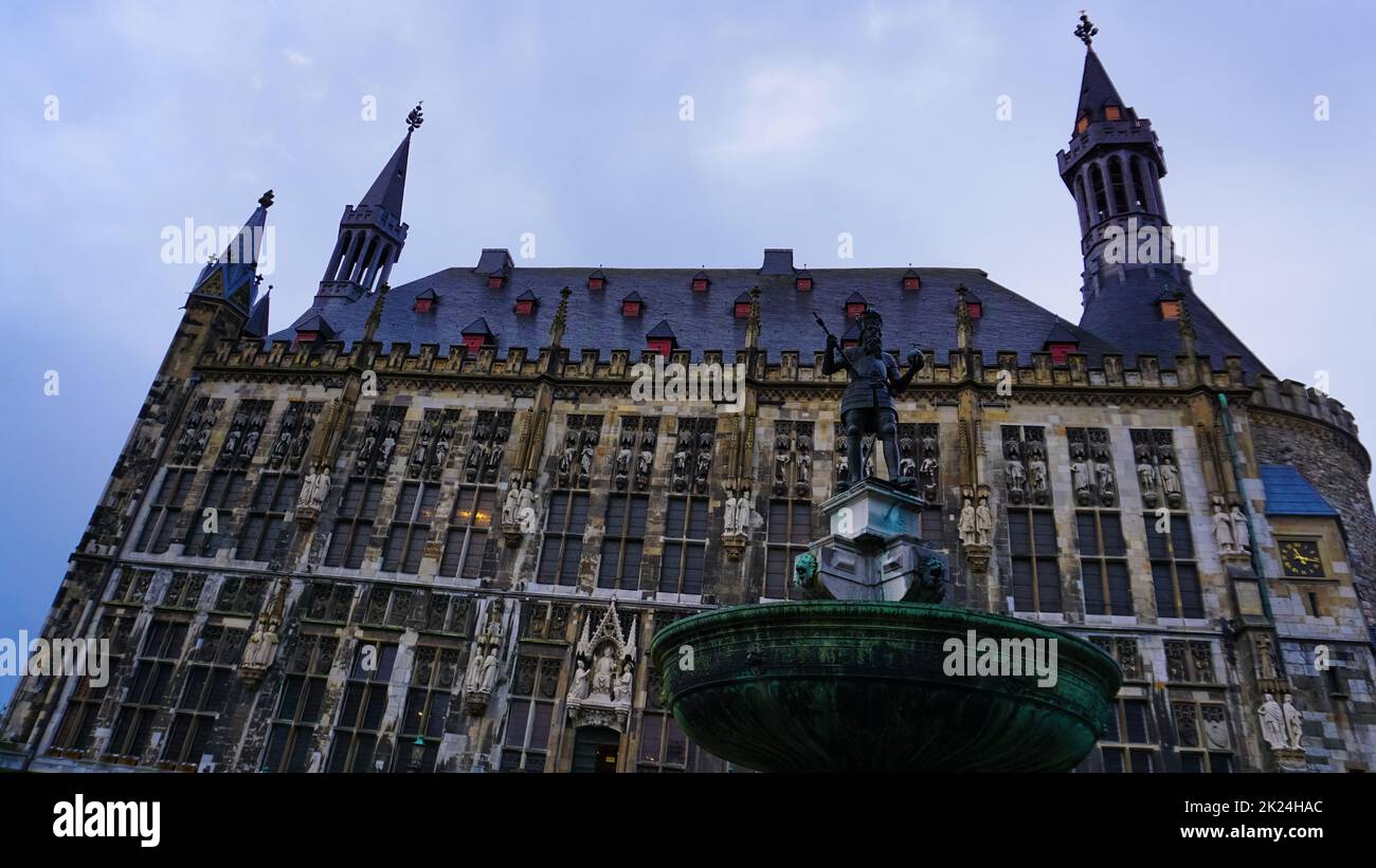 Ancient stone walls and details of Aachen Town Hall on a background of ...