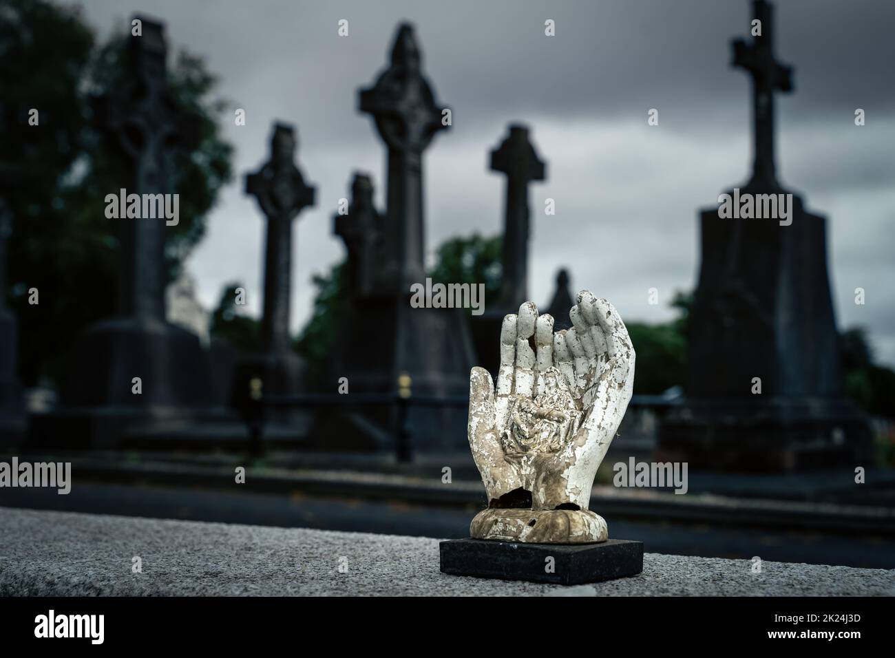 Dublin, Ireland, August 2019 Sculpture of hands holding holly Mary and ...