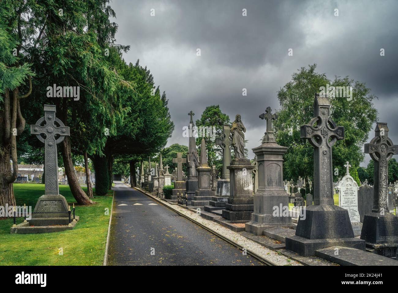 Dublin, Ireland, August 2019 Ancient graves with Celtic crosses and ...