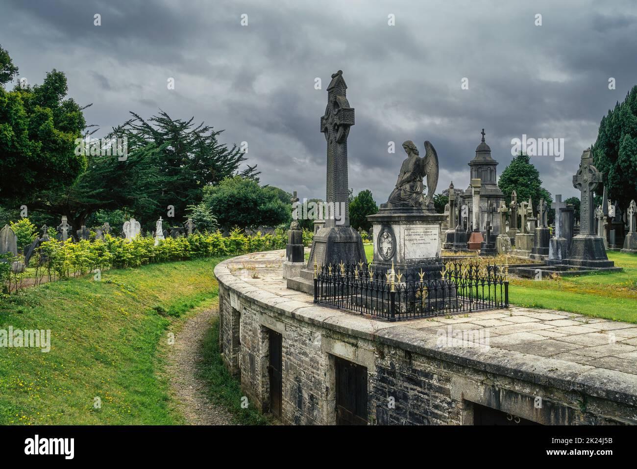 Dublin, Ireland, August 2019 Round mausoleum or crypts with ancient graves and tombstones in ...