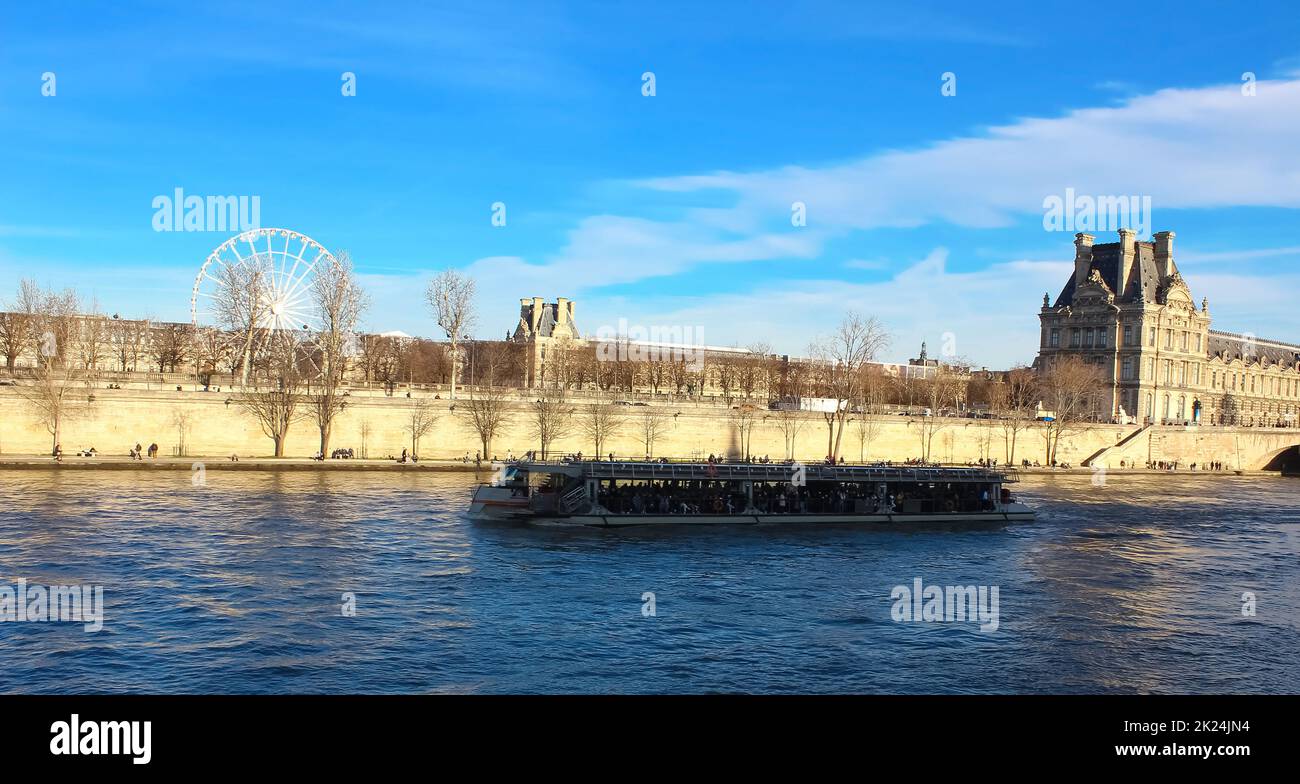 Boat cruising on Seine river at sunny winter day, Paris Stock Photo - Alamy