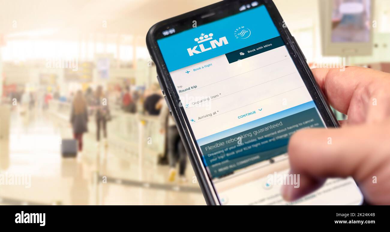 Amsterdam, NED, October 2021: Hand holding a phone with KLM Airlines ...
