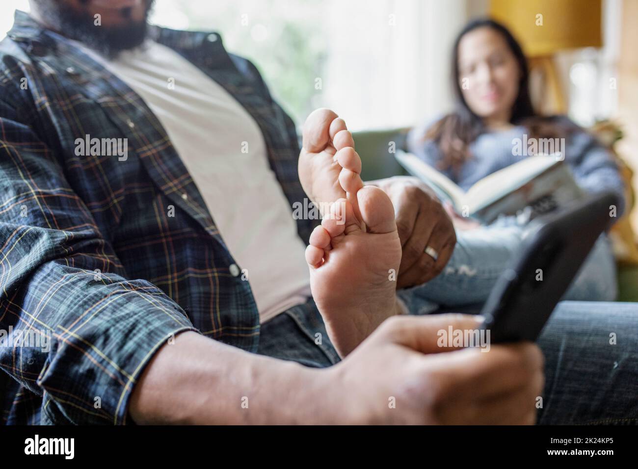 Husband on sofa hi-res stock photography and images - Alamy