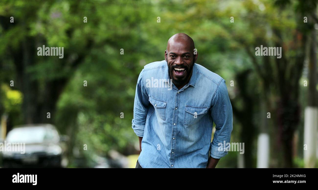 Happy African man dancing celebrating life. Joyful black person laughin ...