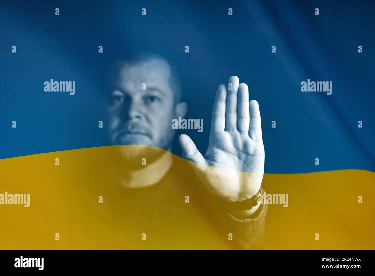 War between Russia and Ukraine. Man with sad sight, showing Stop ...