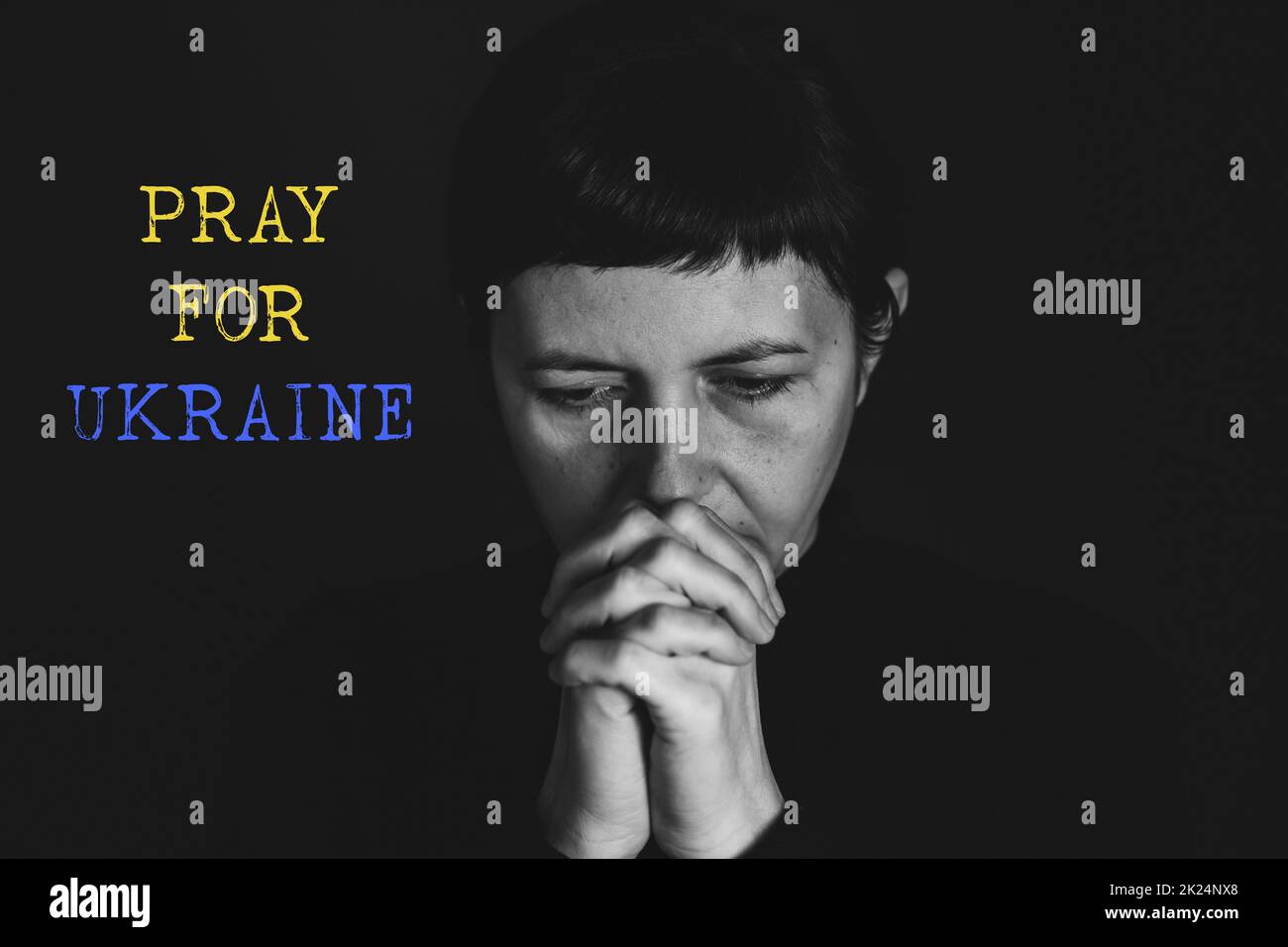 Sad woman with Ukraine flag at background praying. Concept of standing ...