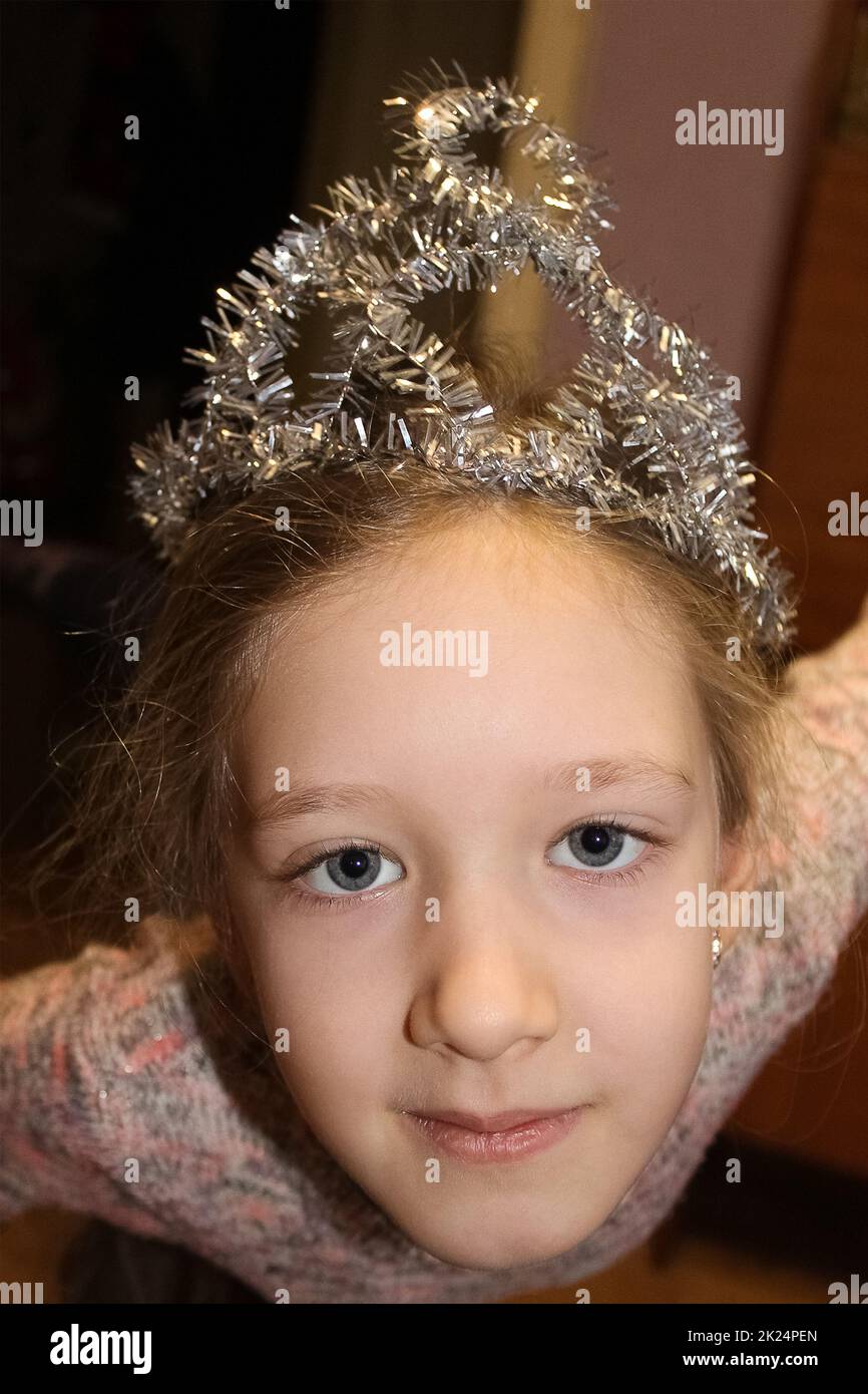 Laughing surprised cute girl portrait. Funny child on home background ...