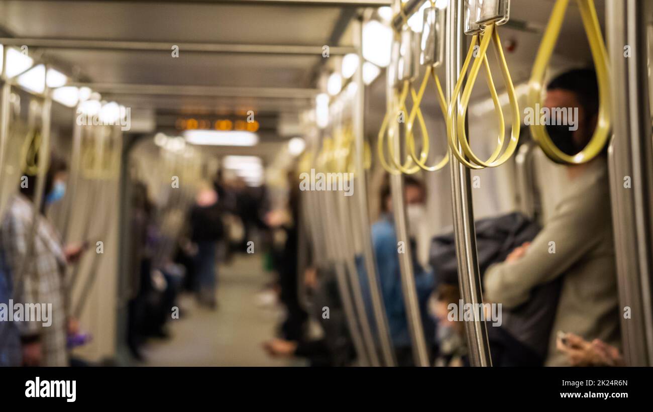 Hanging handrails in a metro. Plastic yellow grip on strap in public ...