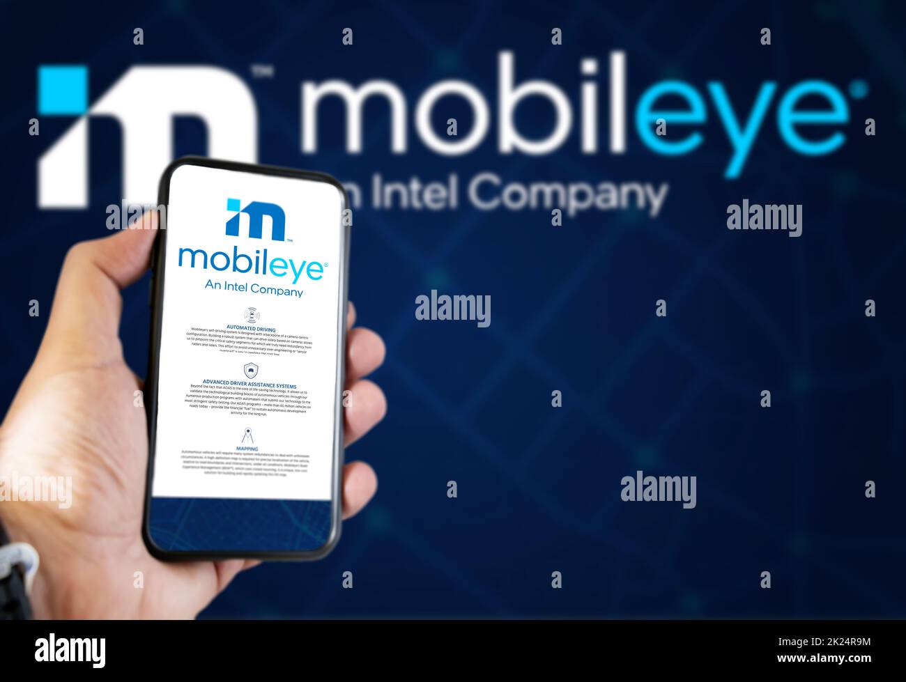 Jerusalem, ISR, March 2022: Mobileye company’s website on a phone screen. Blue background with ...