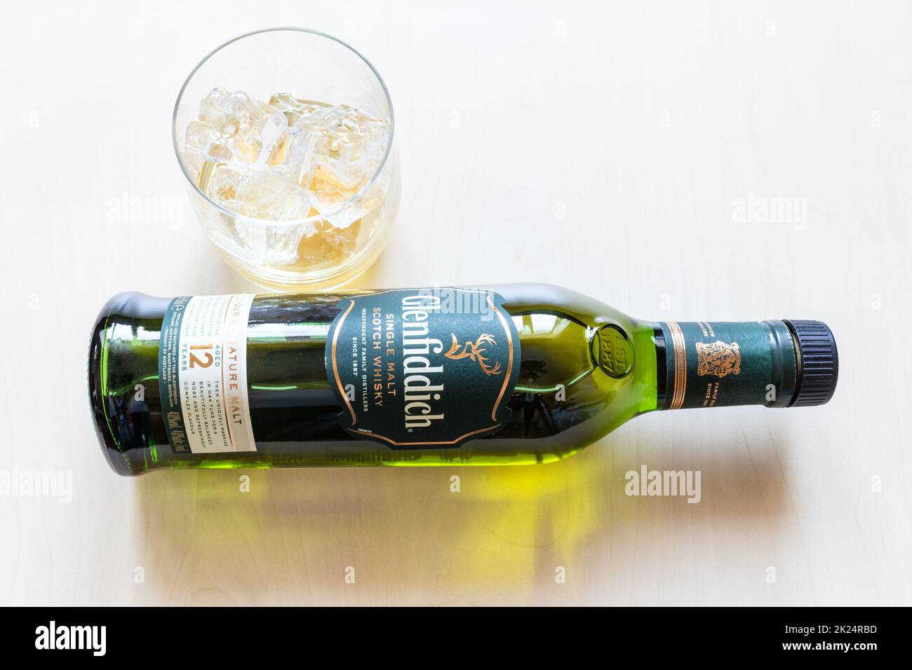 Moscow, Russia - March 20, 2022: glass and lying bottle of 12 years old ...