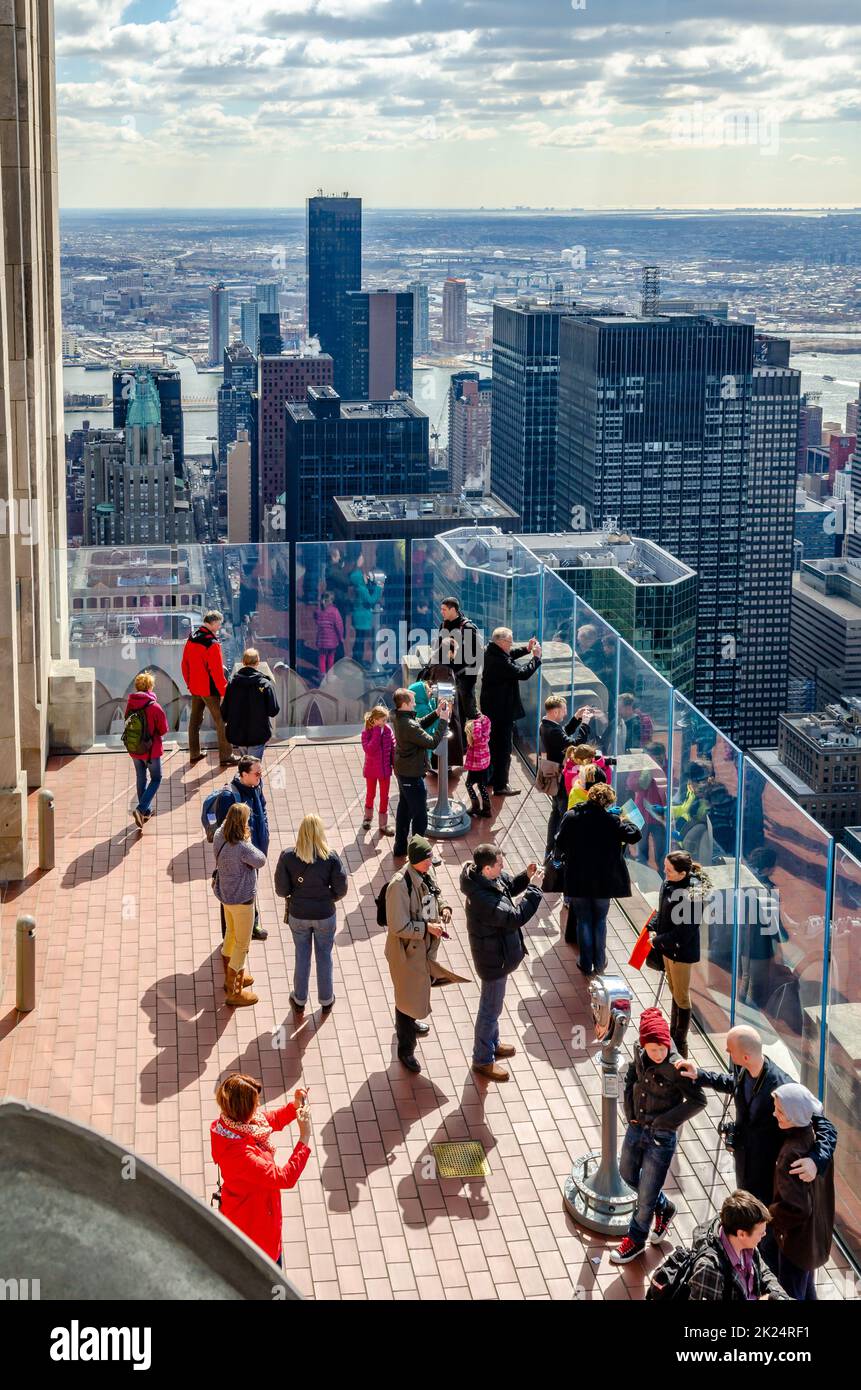 People tourists on the observation deck of Rockefeller Center, view ...