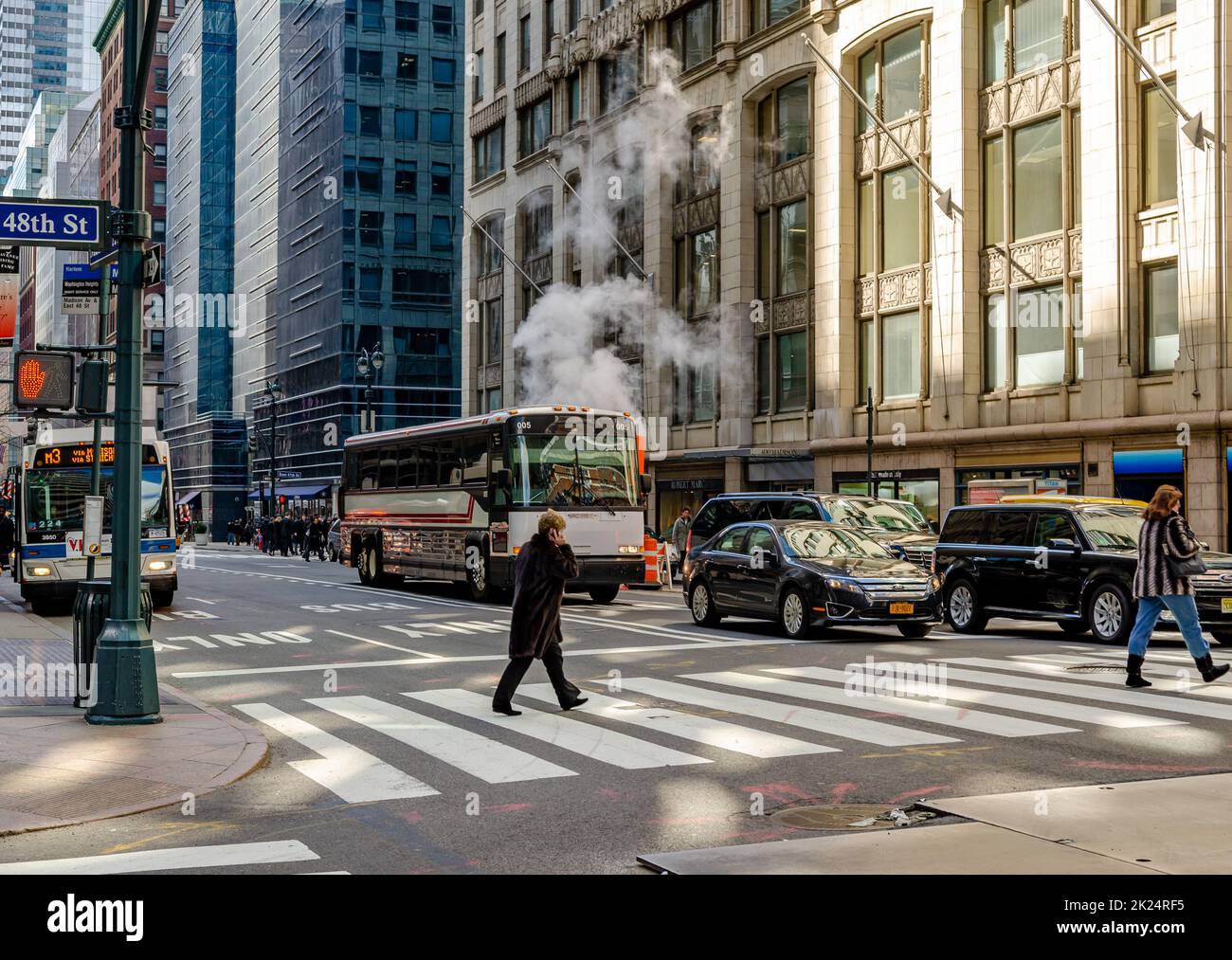 People crossing the Street on a crosswalk in Manhattan at East 48th ...