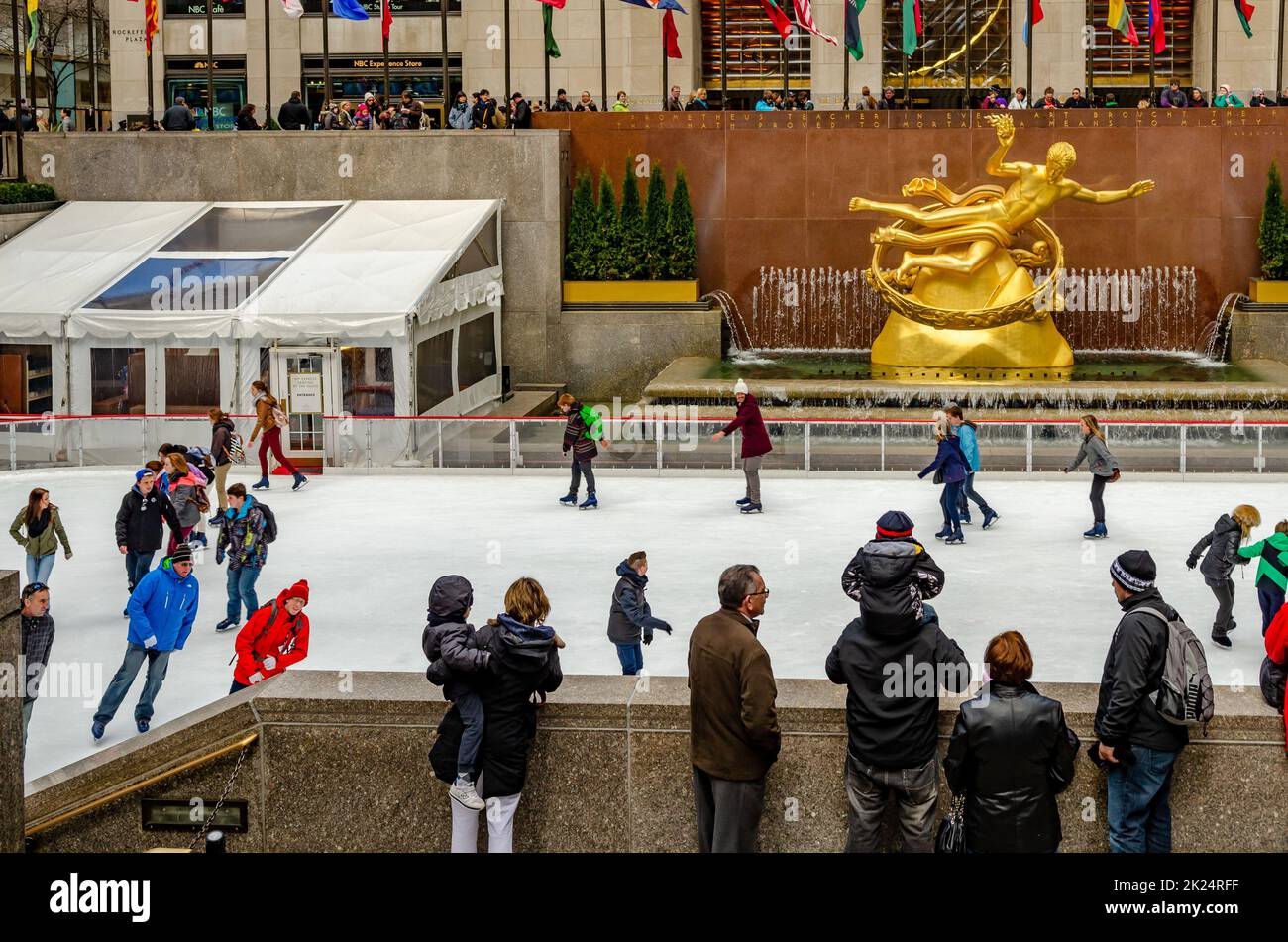 The Rink At Rockefeller Center during winter, Lots of People skating on ...