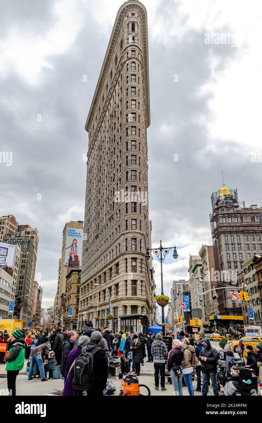Flatiron Building New York City with lots of People standing in the ...