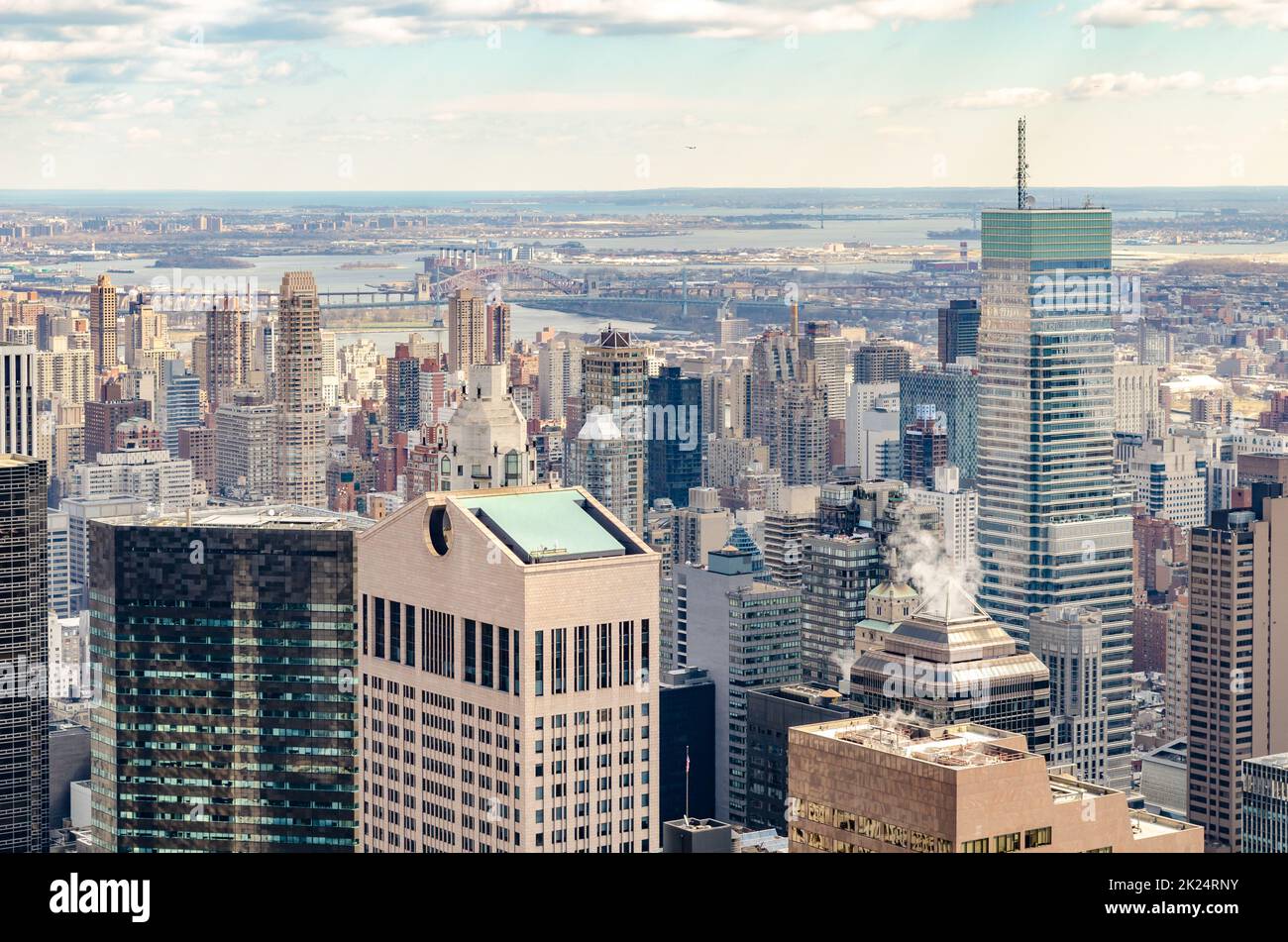 East River with Skyscraper of Manhattan in the front, aerial view from ...
