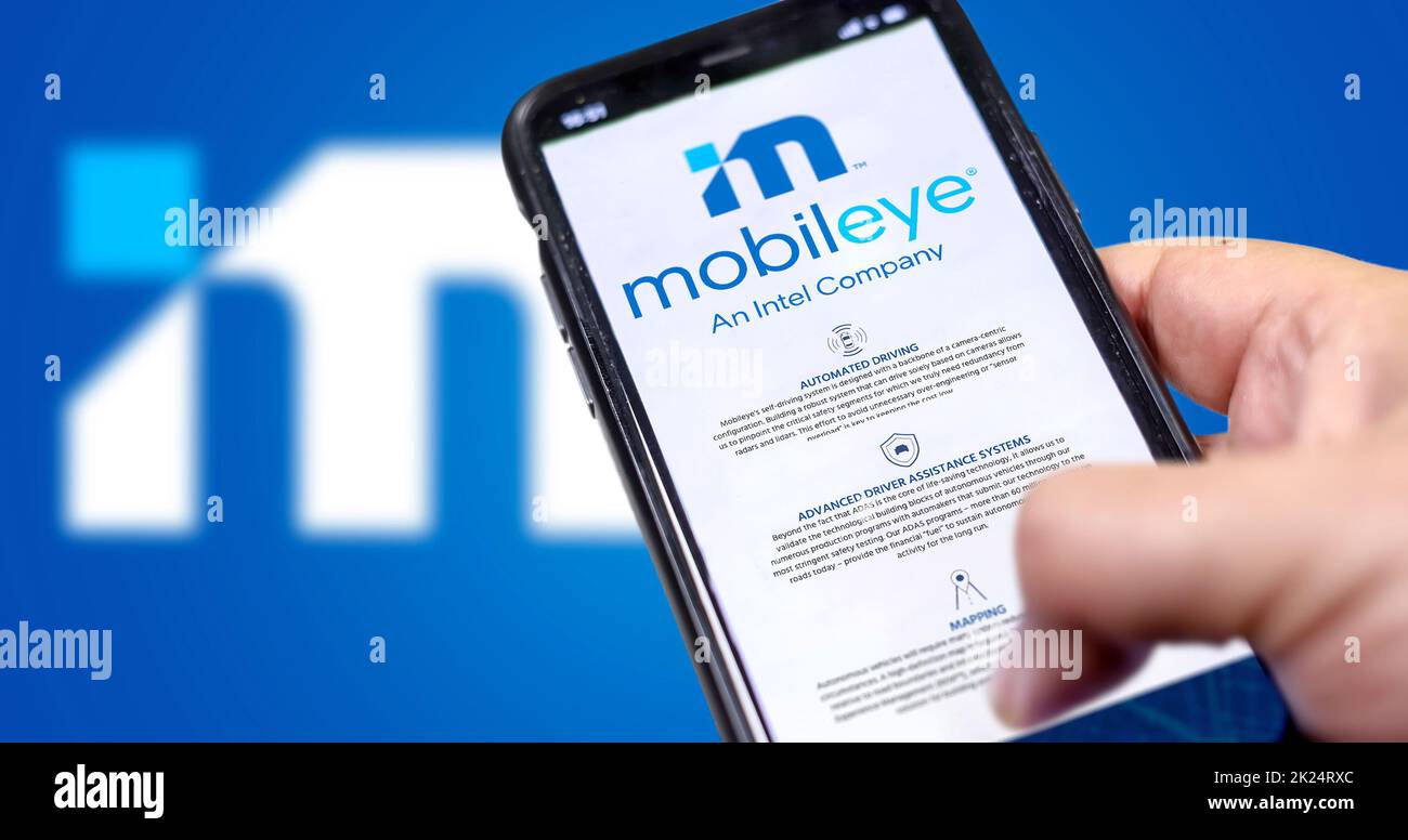Jerusalem, ISR, March 2022: Mobileye company’s website on a phone screen. Blue background with ...