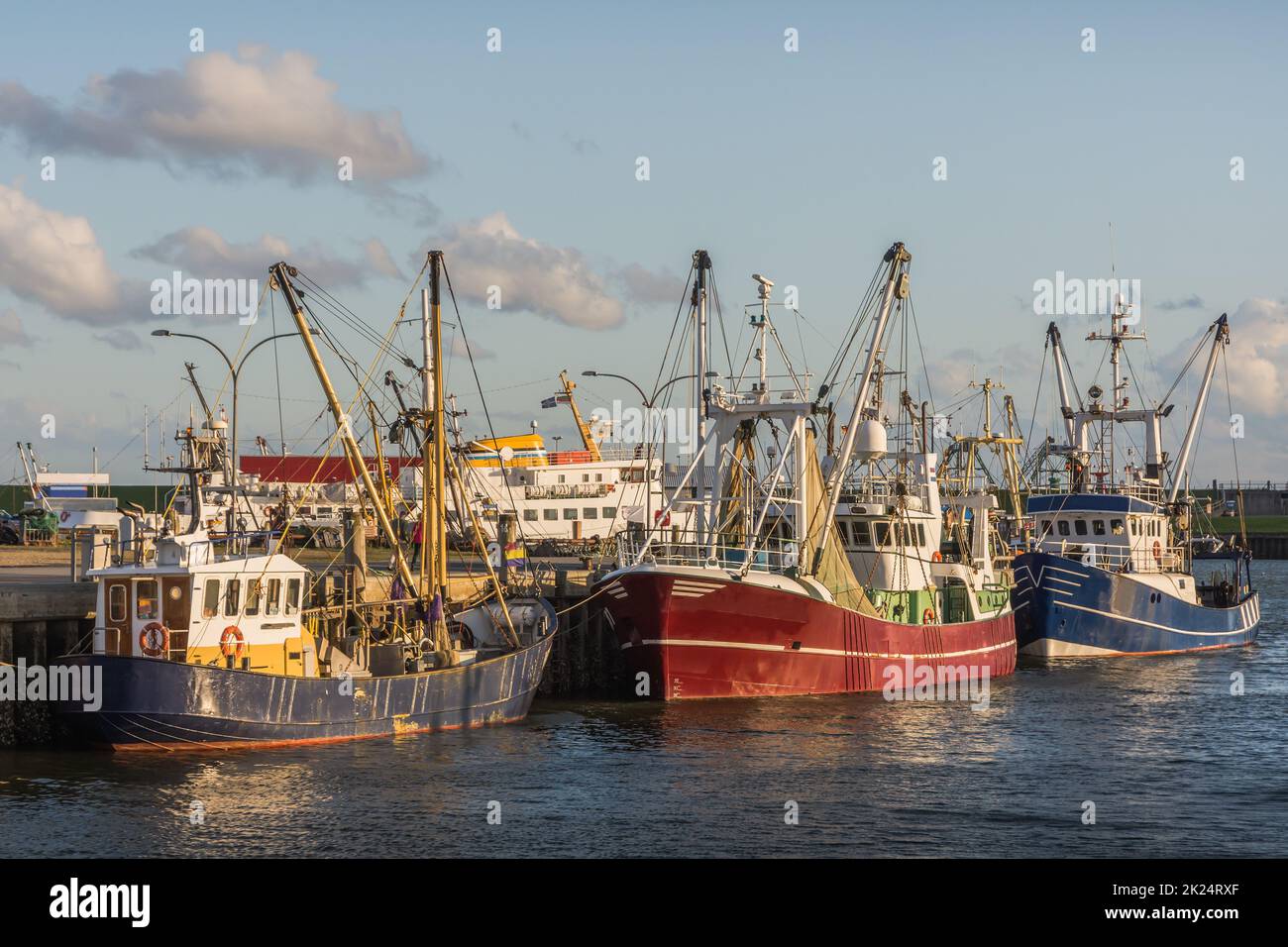Fishing boats moored at the pier of the fishing port in Buesum ...