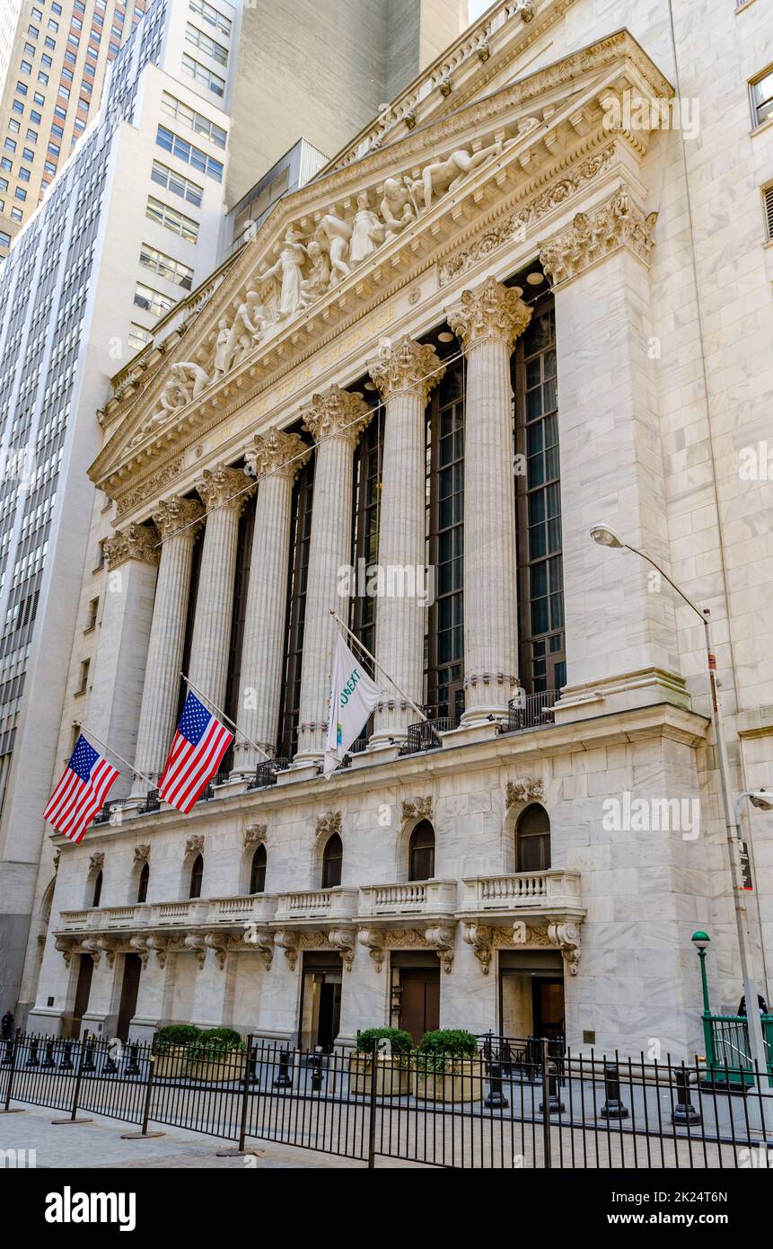 New York Stock Exchange Building with columns and American flag hanging ...